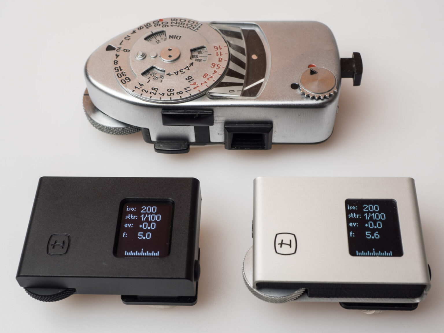 Hedeco Lime Two attachable light meter and one of its ancestors
