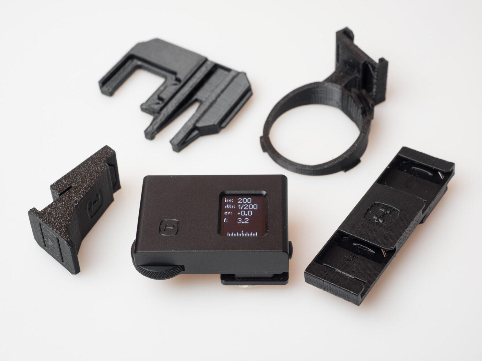 Hedeco Lime Two attachable light meter and one of its ancestors