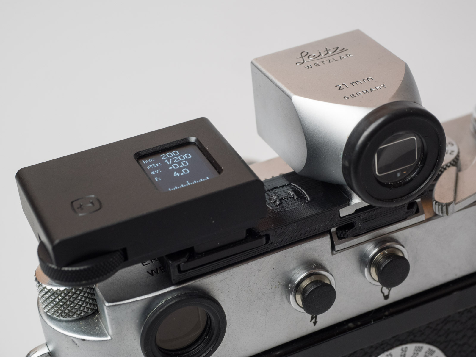 Hedeco Lime Two attachable light meter and one of its ancestors